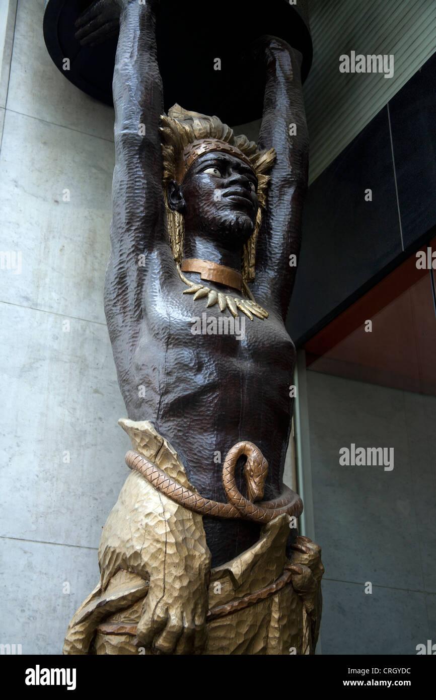 Statue of an African man outside a shop on Avenue Louise Brussels ...