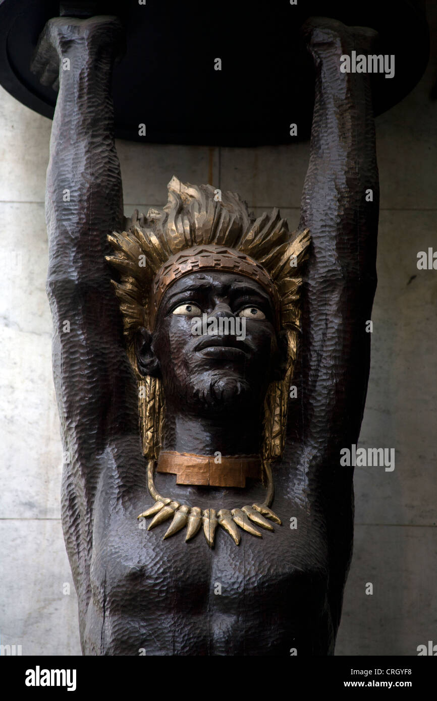 Statue of an African man outside a shop on Avenue Louise Brussels ...