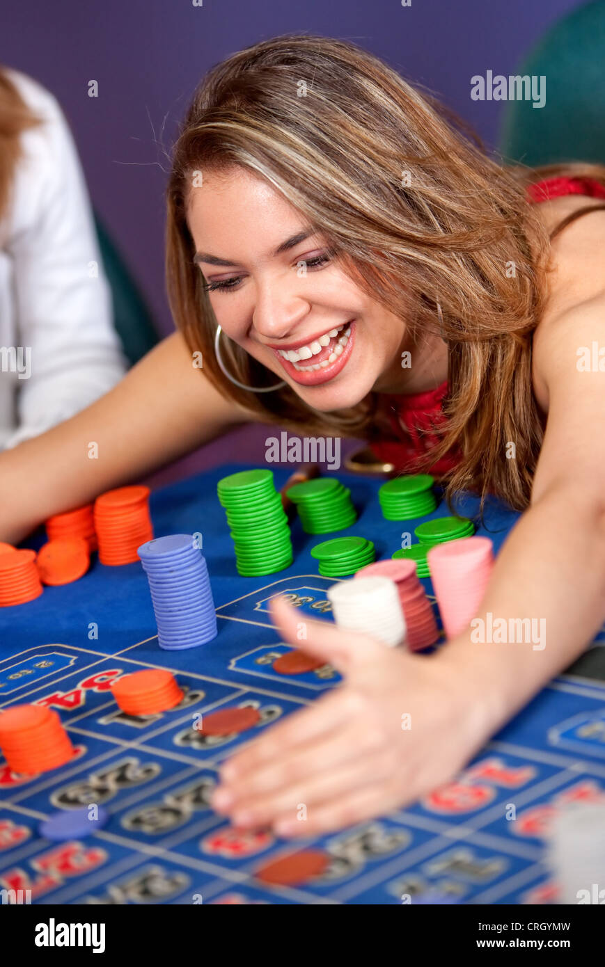 young woman in the casino winning at the roulette Stock Photo - Alamy