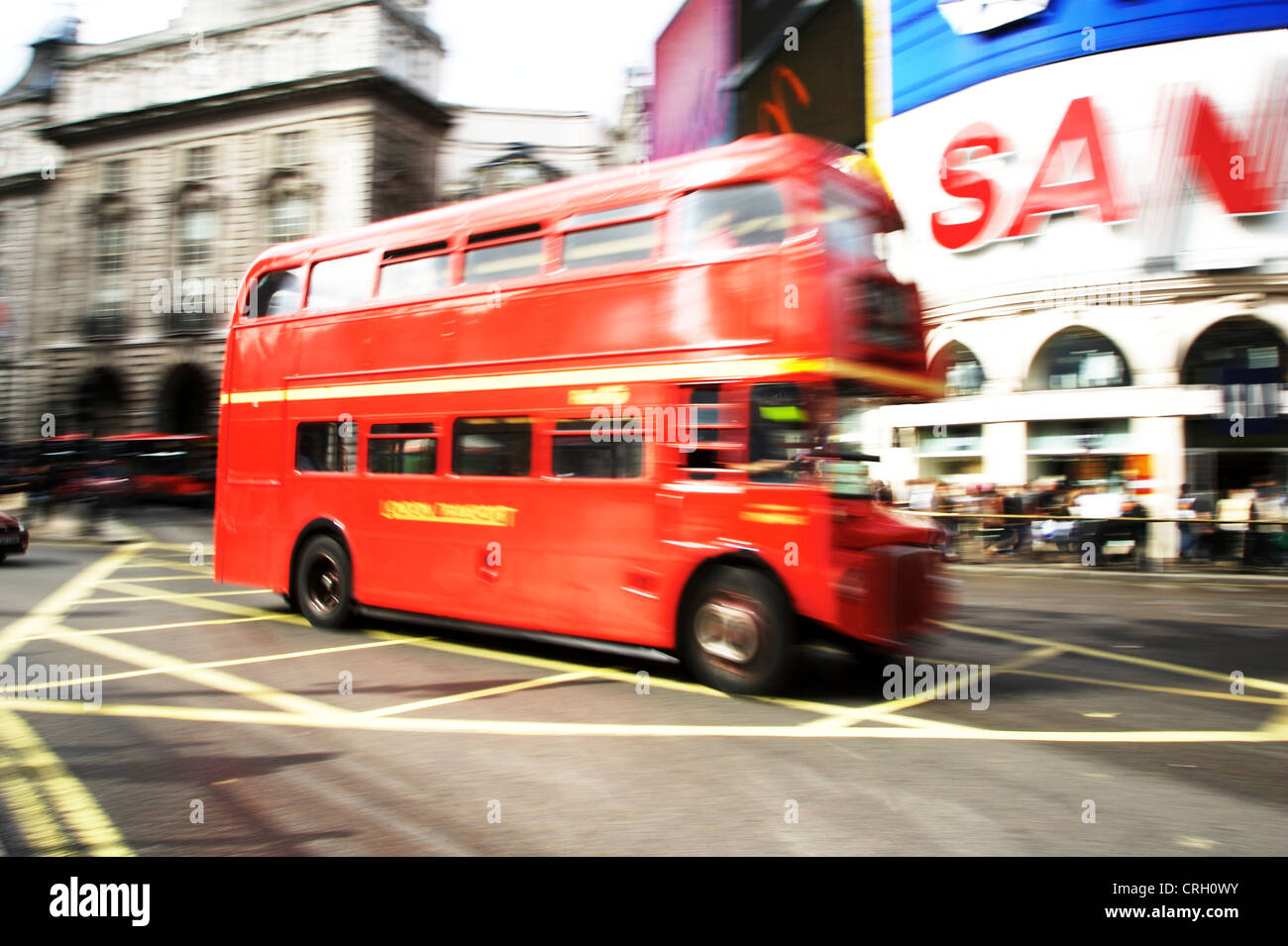 Red Routemaster bus driving through Piccadilly Circus London Stock ...