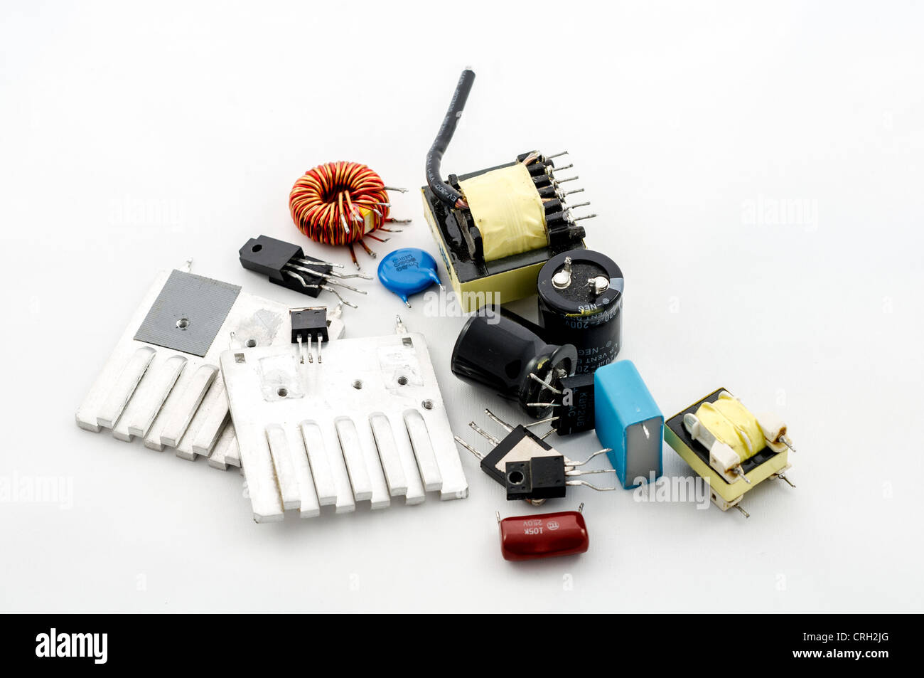 Several electric parts isolated on white background Stock Photo - Alamy