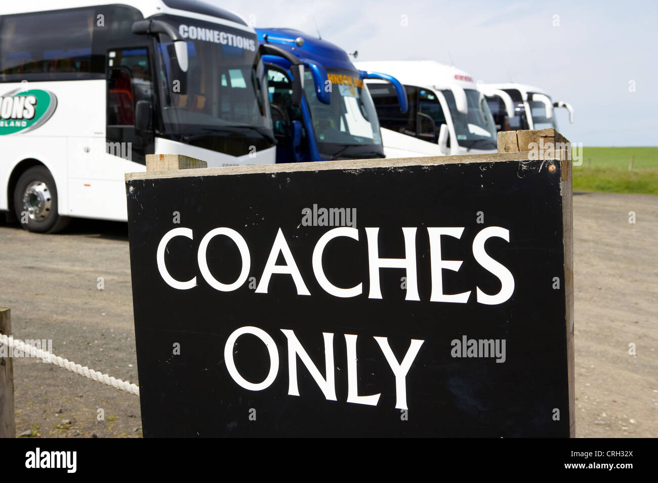 tour coaches parked in a tourist car park at a tourist attraction ...