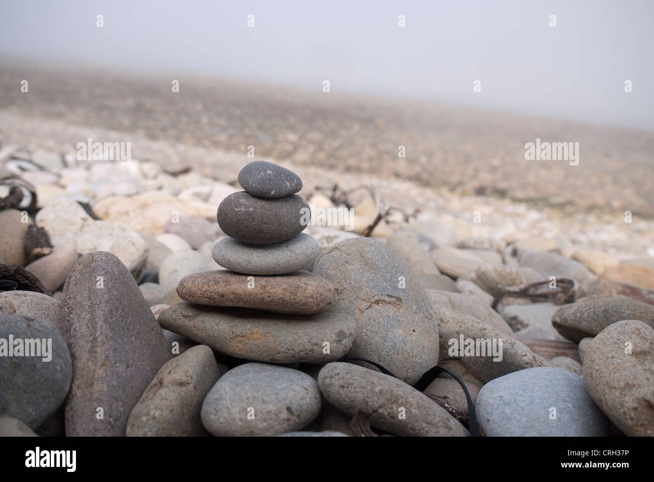 pebbles balanced on a beach Stock Photo - Alamy