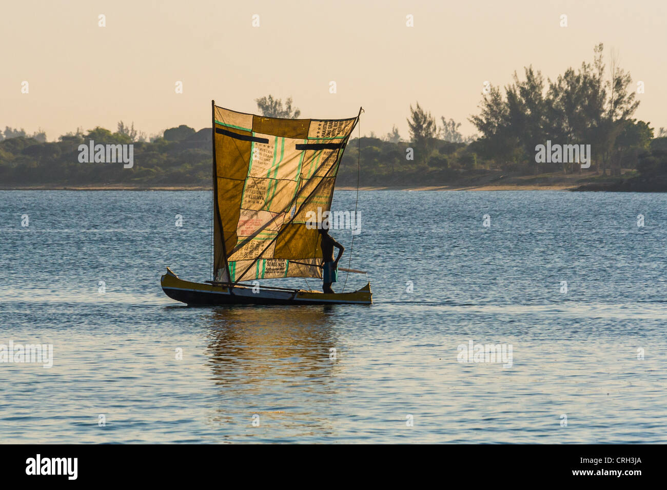 Malagasy outrigger pirogue with makeshift sails Stock Photo - Alamy