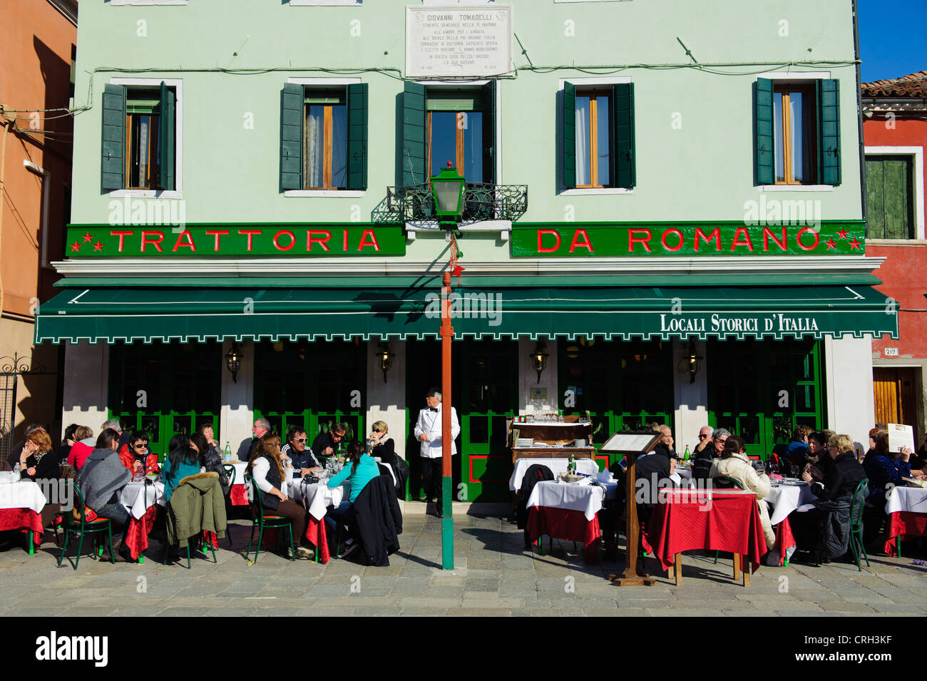 People eating in the terrace of a Traditional italian restaurant ...