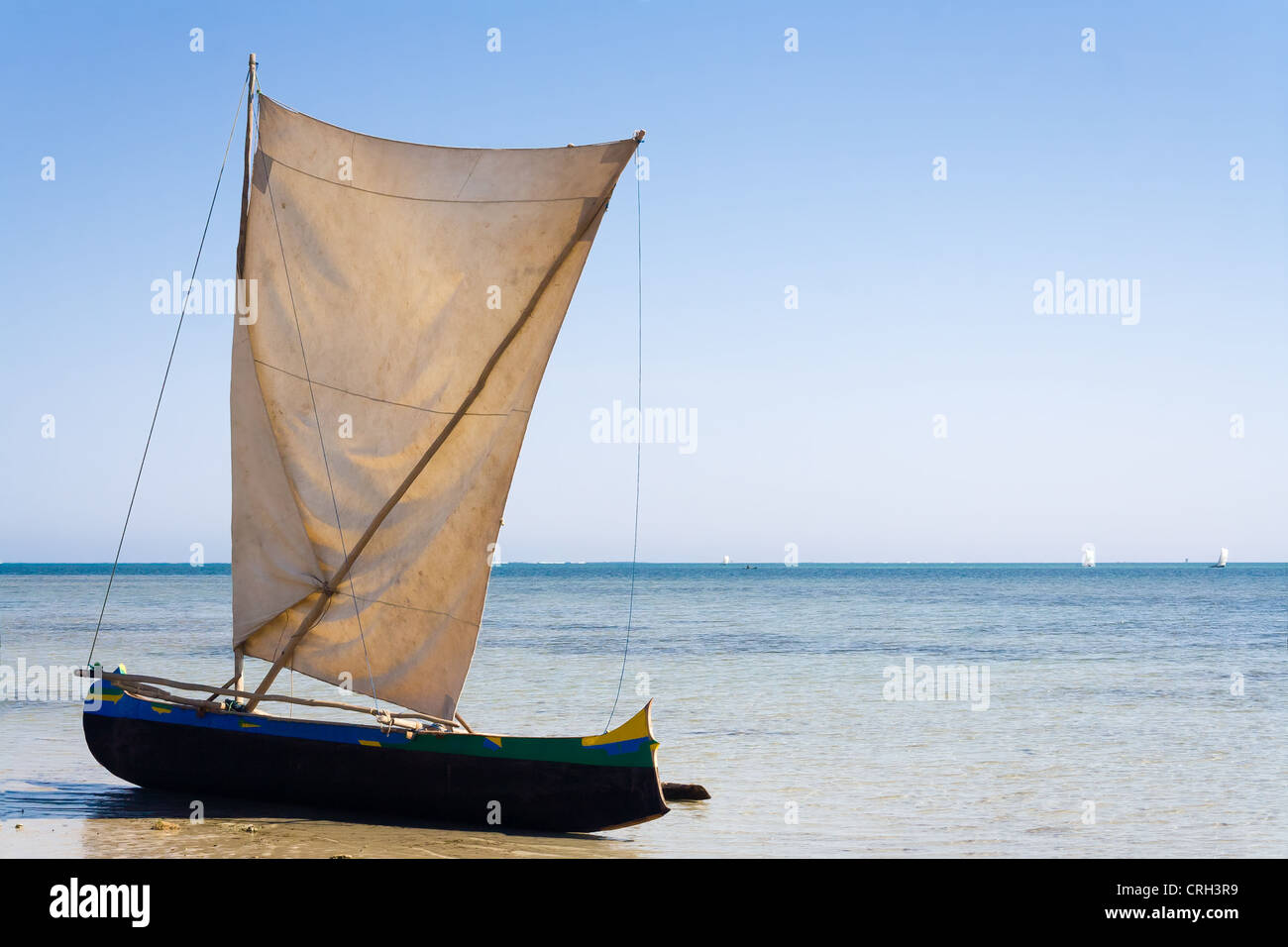 Malagasy outrigger pirogue with makeshift sails Stock Photo - Alamy
