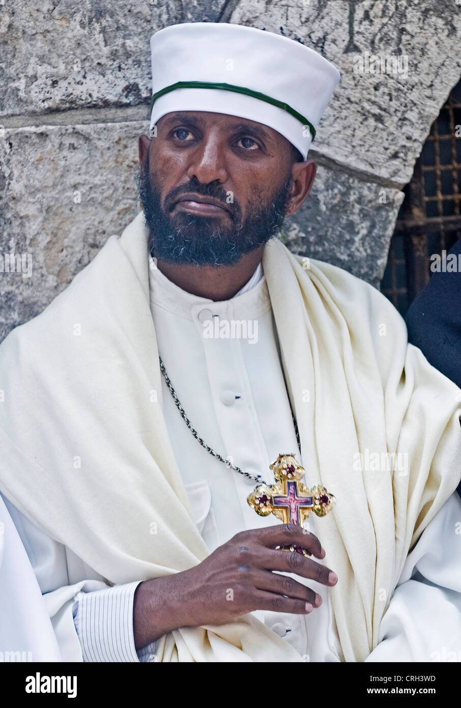 Ethiopian Orthodox priest await the start of the Holy fire ceremony at ...
