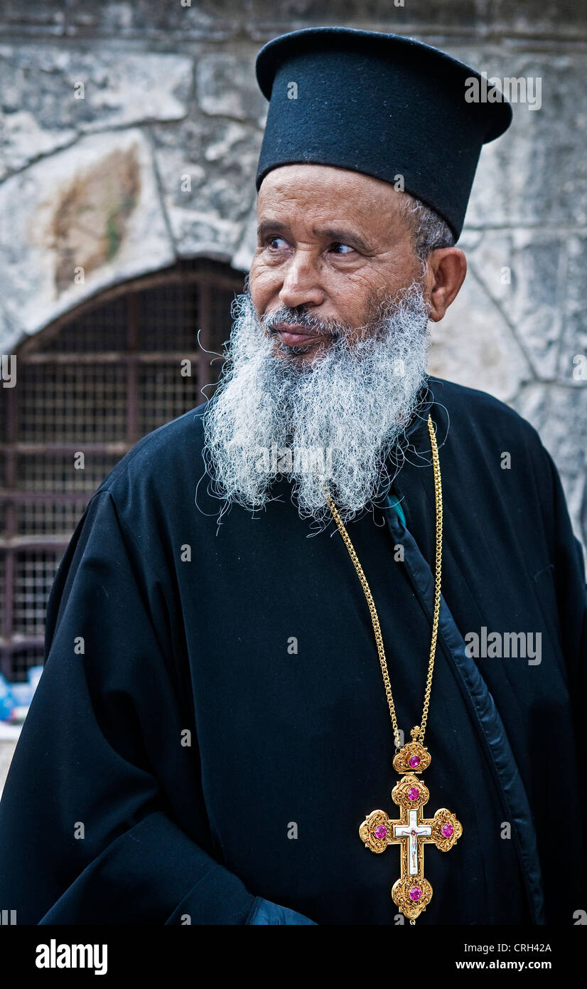 Ethiopian Orthodox priest await the start of the Holy fire ceremony at ...