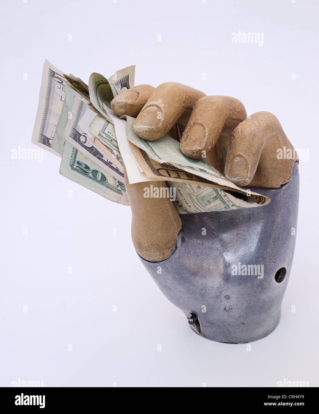 mechanical hand holding U.S. currency Stock Photo - Alamy