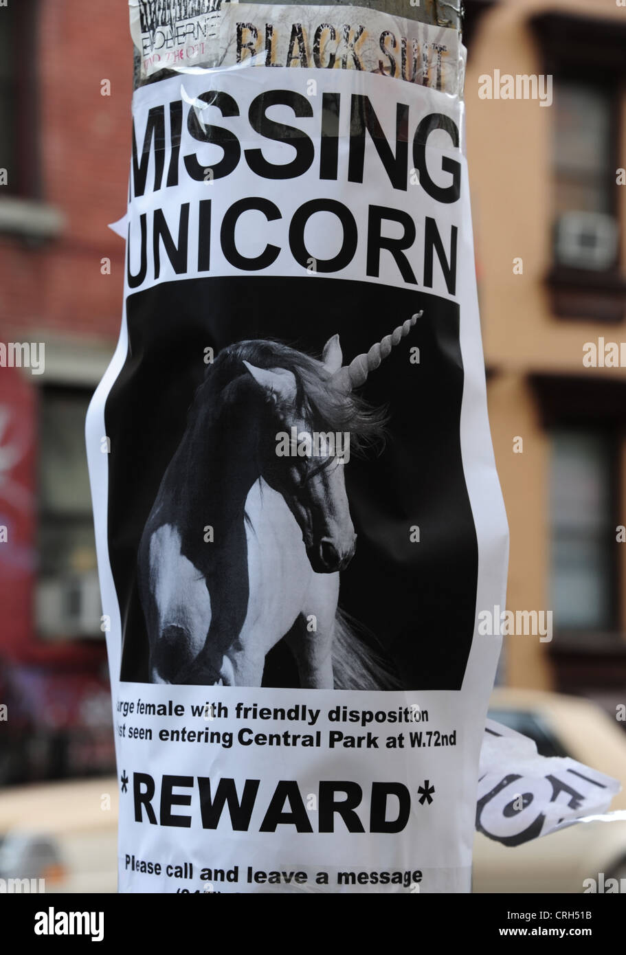 Monochrome 'Missing Unicorn' photograph advertisement stuck to a lamp ...