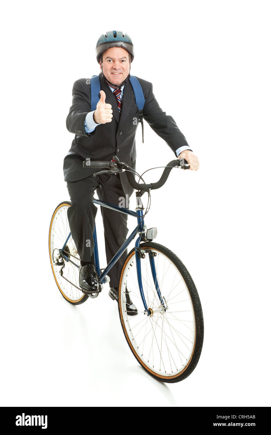 Businessman bicycling to work and giving a thumbs up for energy ...