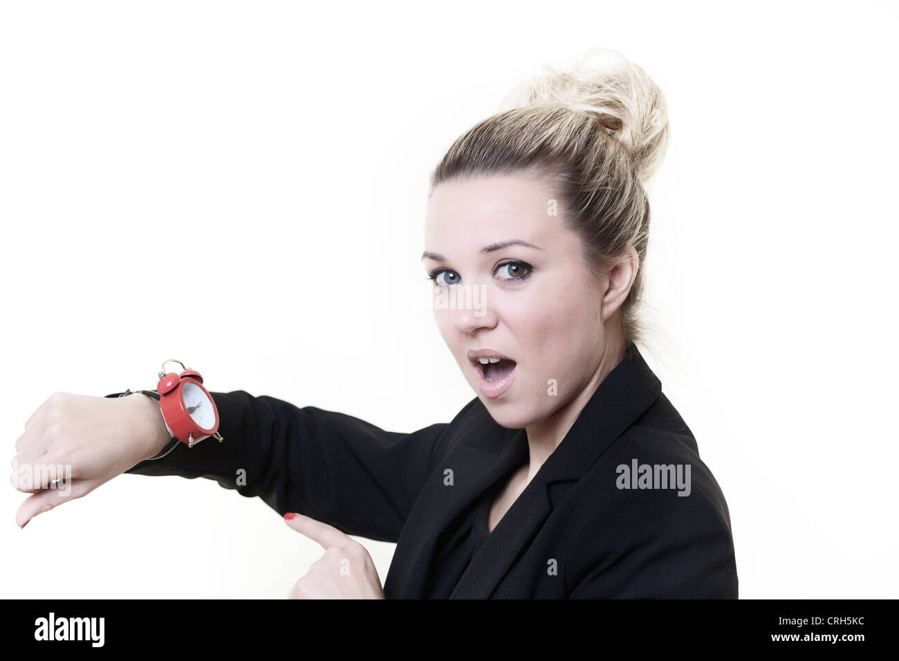 woman in a suit looking at a wrist watch made to look like a ...