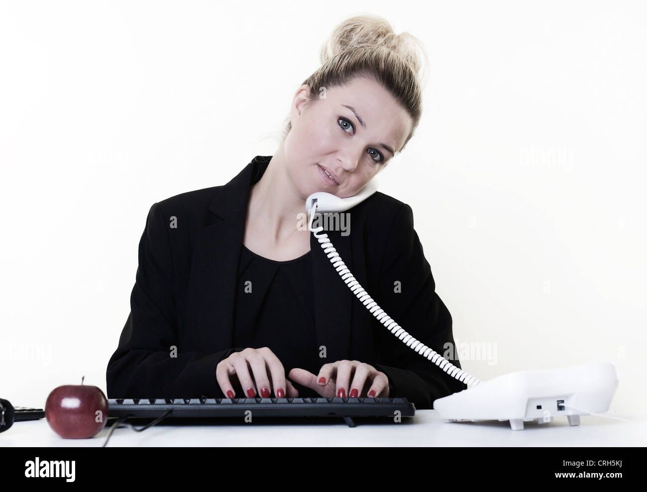 businesswoman working very hard at hes desk Stock Photo - Alamy