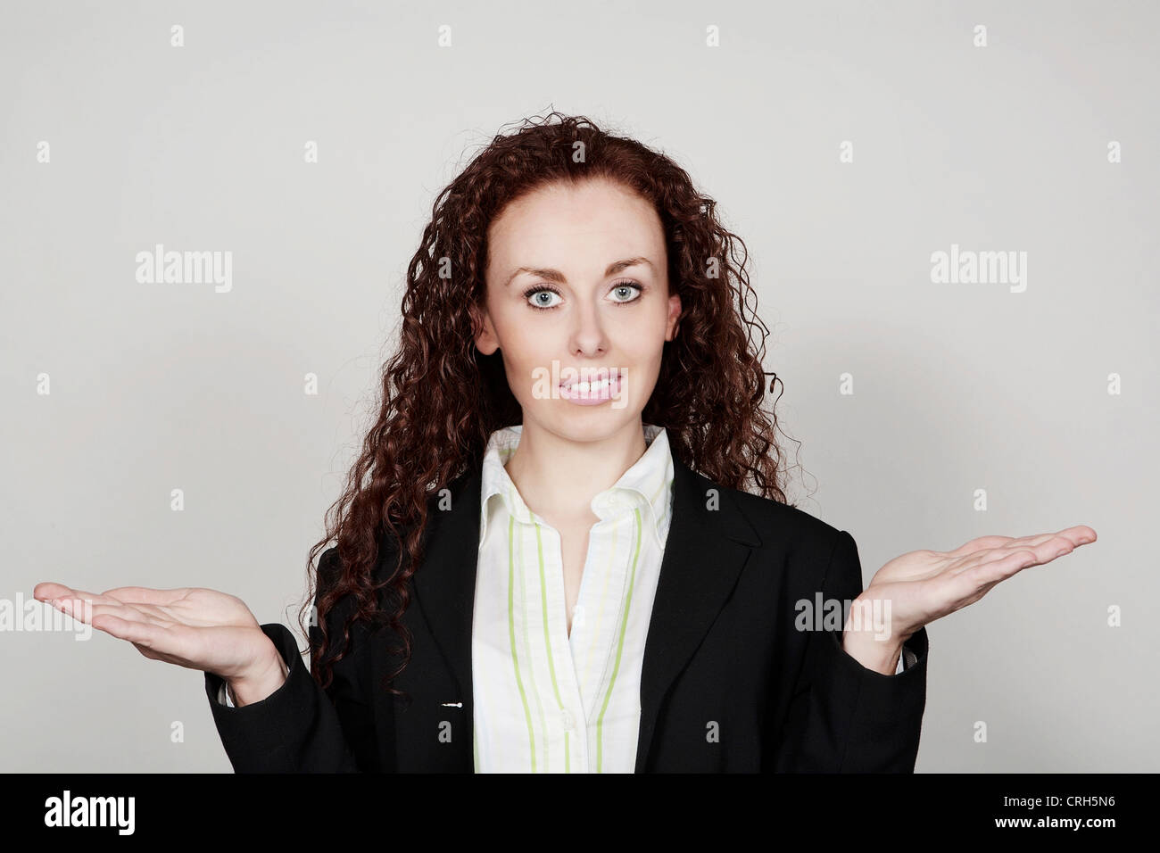 woman holding out hand showing you something Stock Photo - Alamy