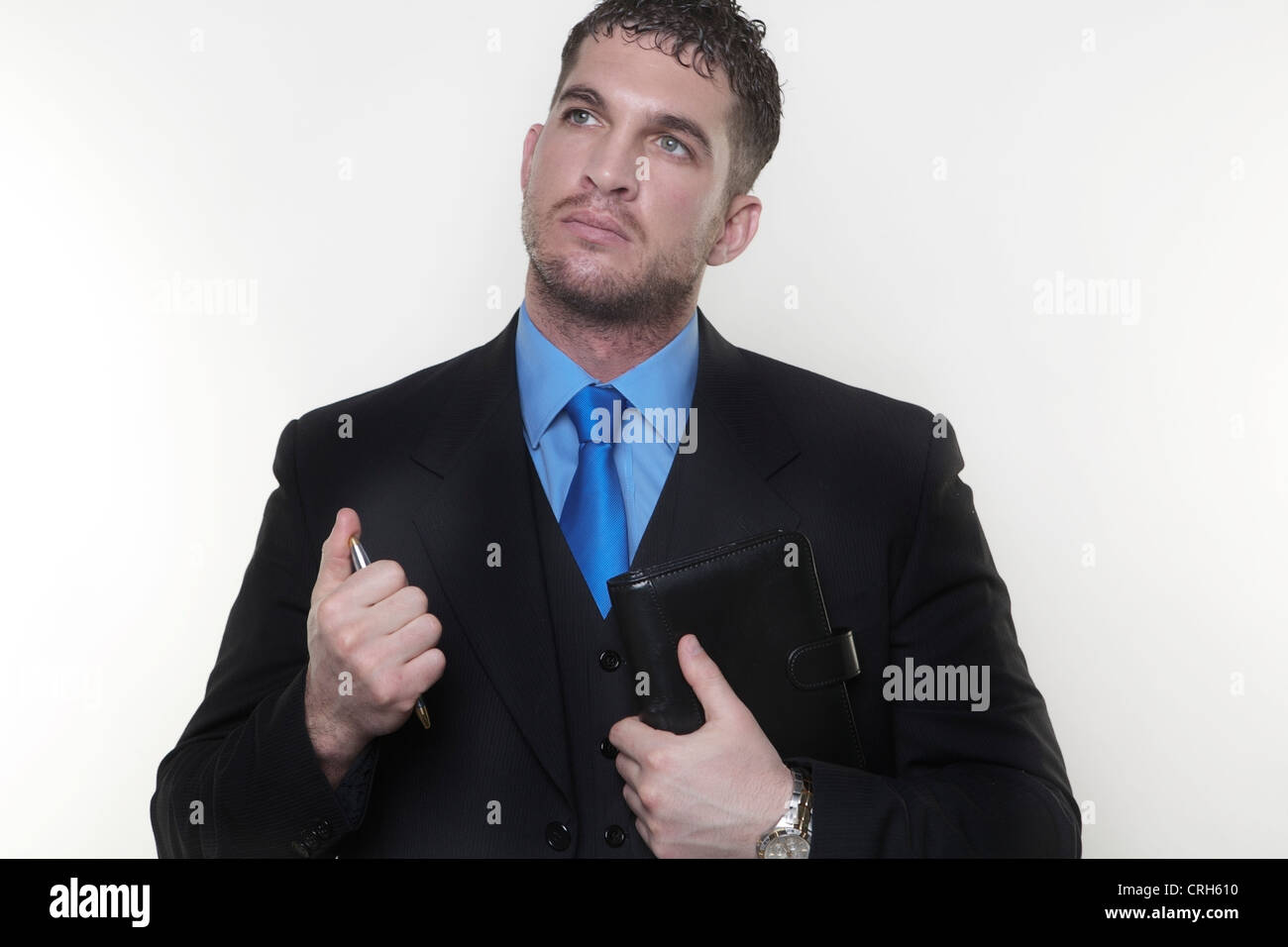 handsome business man standing poses looking around Stock Photo - Alamy