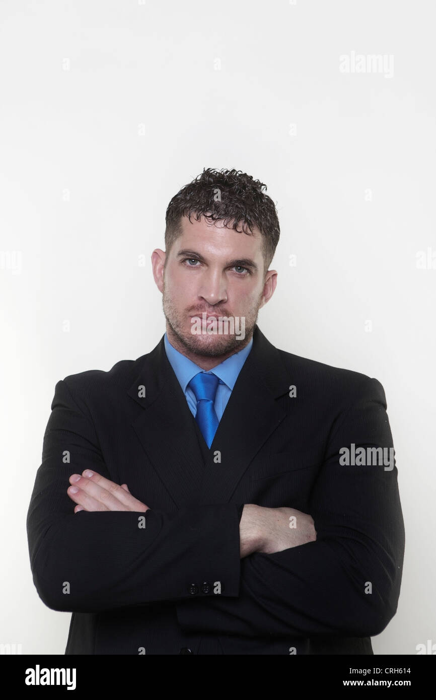 handsome business man standing poses looking around Stock Photo - Alamy