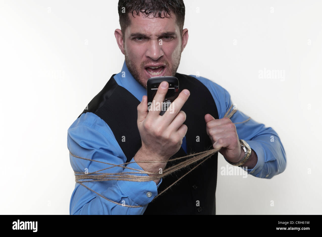 man with string around him caught up on a mobile phone Stock Photo - Alamy