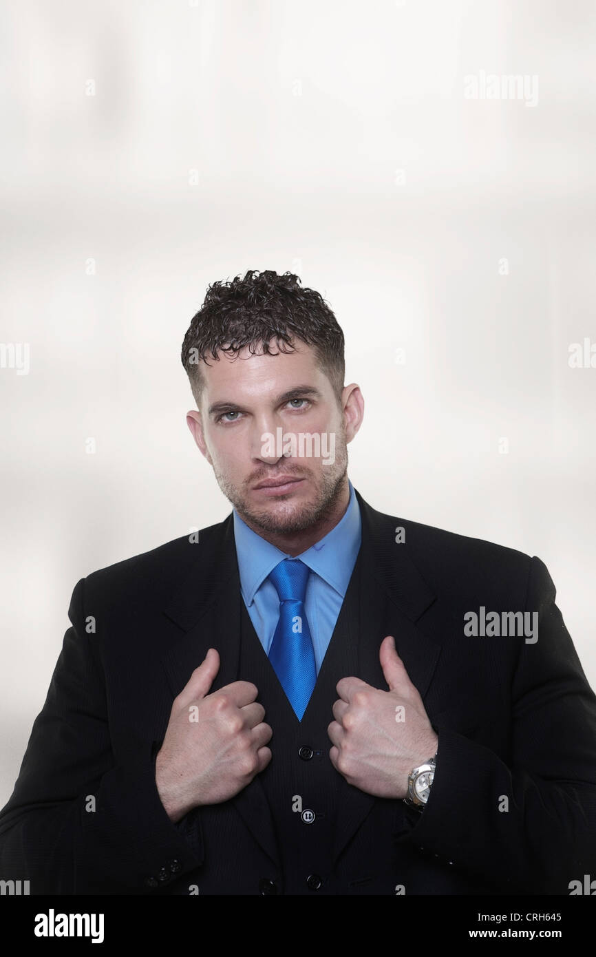 handsome business man standing poses looking around Stock Photo - Alamy