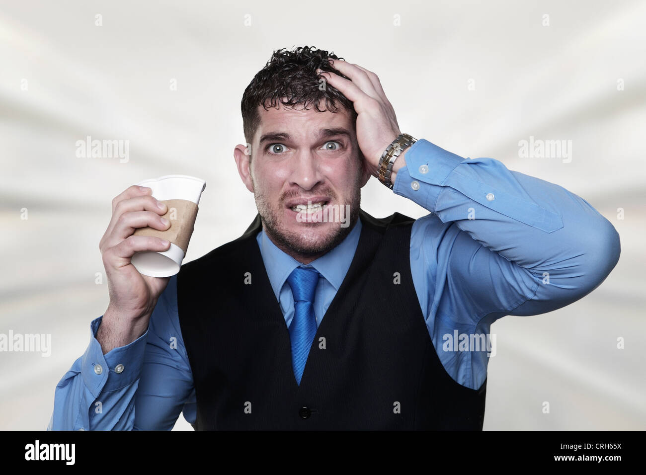 stress out business man pulling at his hair and squashing a paper ...