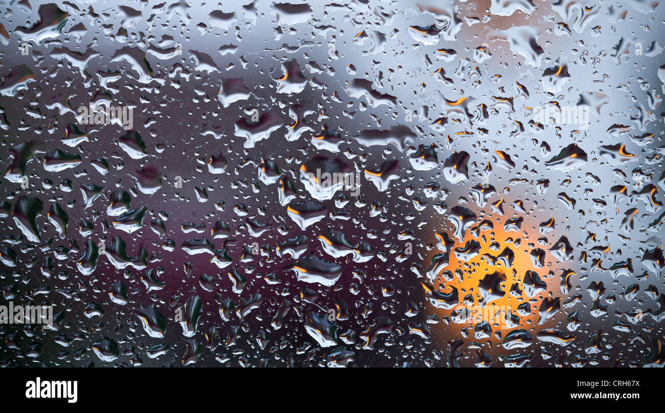 Beautiful abstract colorful background with water drops over window ...