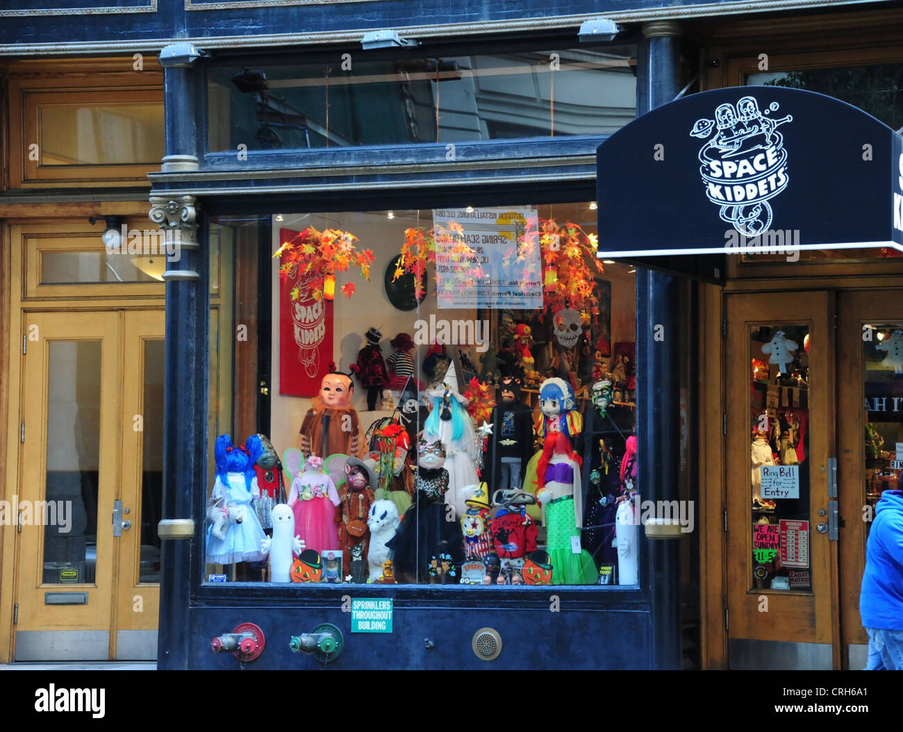 Mannequins standing in electric lights window, blue front Space Kiddets ...