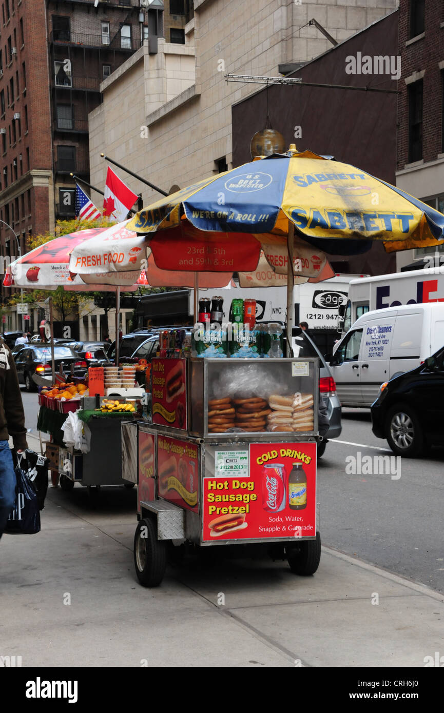 Food stalls 2 mobile standing grey flagstones sidewalk right foreground ...