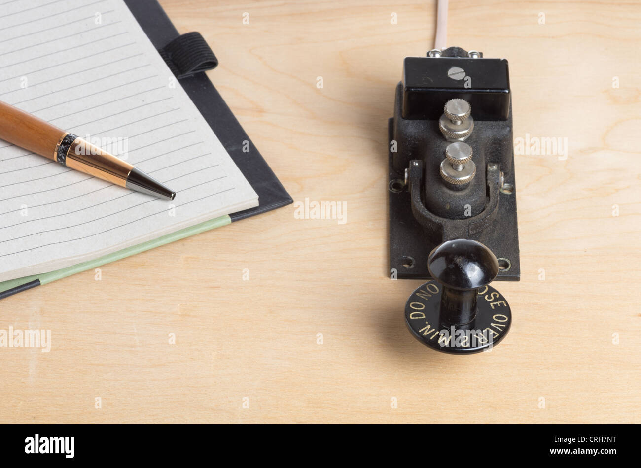 A vintage telegraph key with notebook Stock Photo - Alamy
