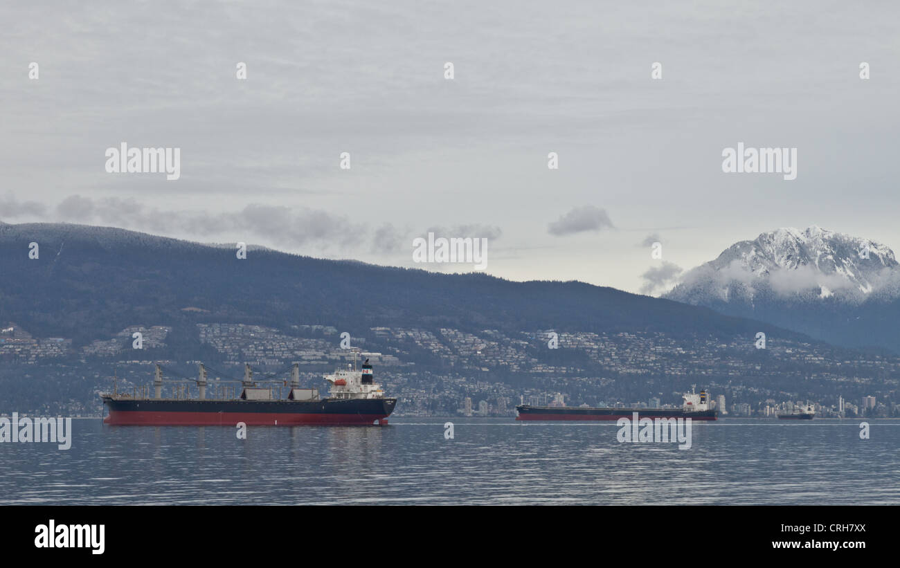 Cargo ships wait in the English Channel along North and West Vancouver ...