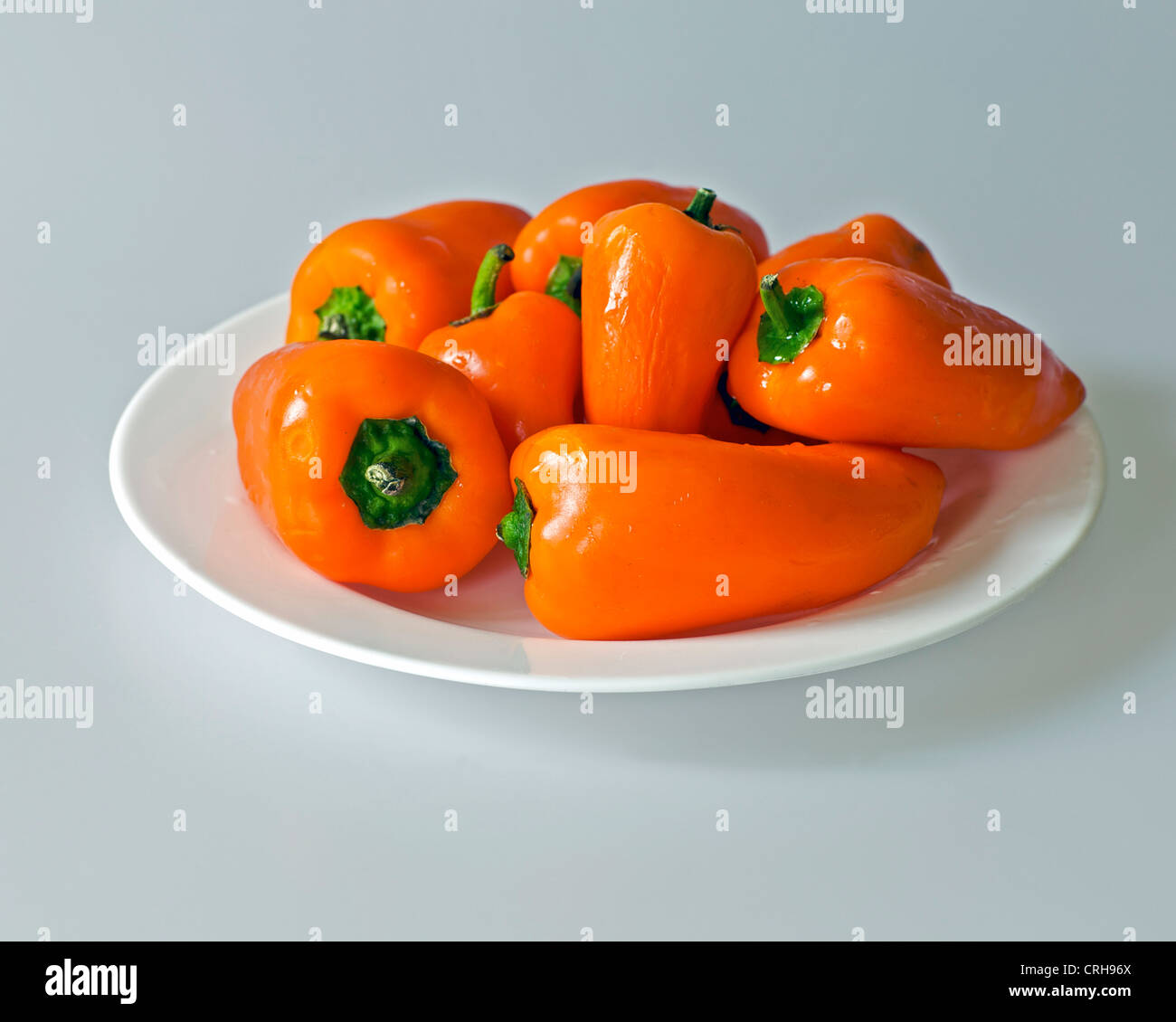 plate of orange peppers Stock Photo - Alamy