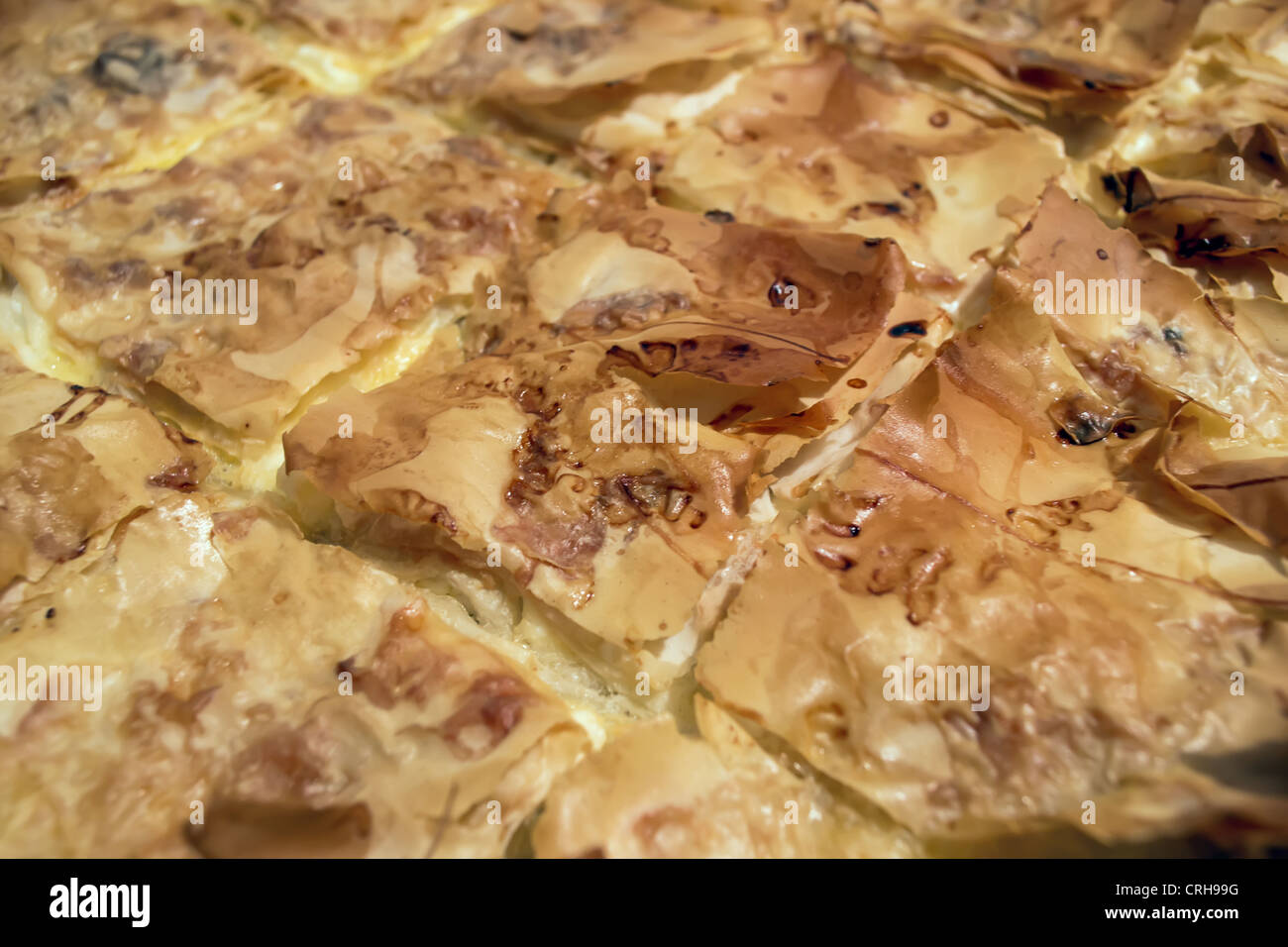 Pastry of pressed dough sheets with cheese and eggs Stock Photo - Alamy
