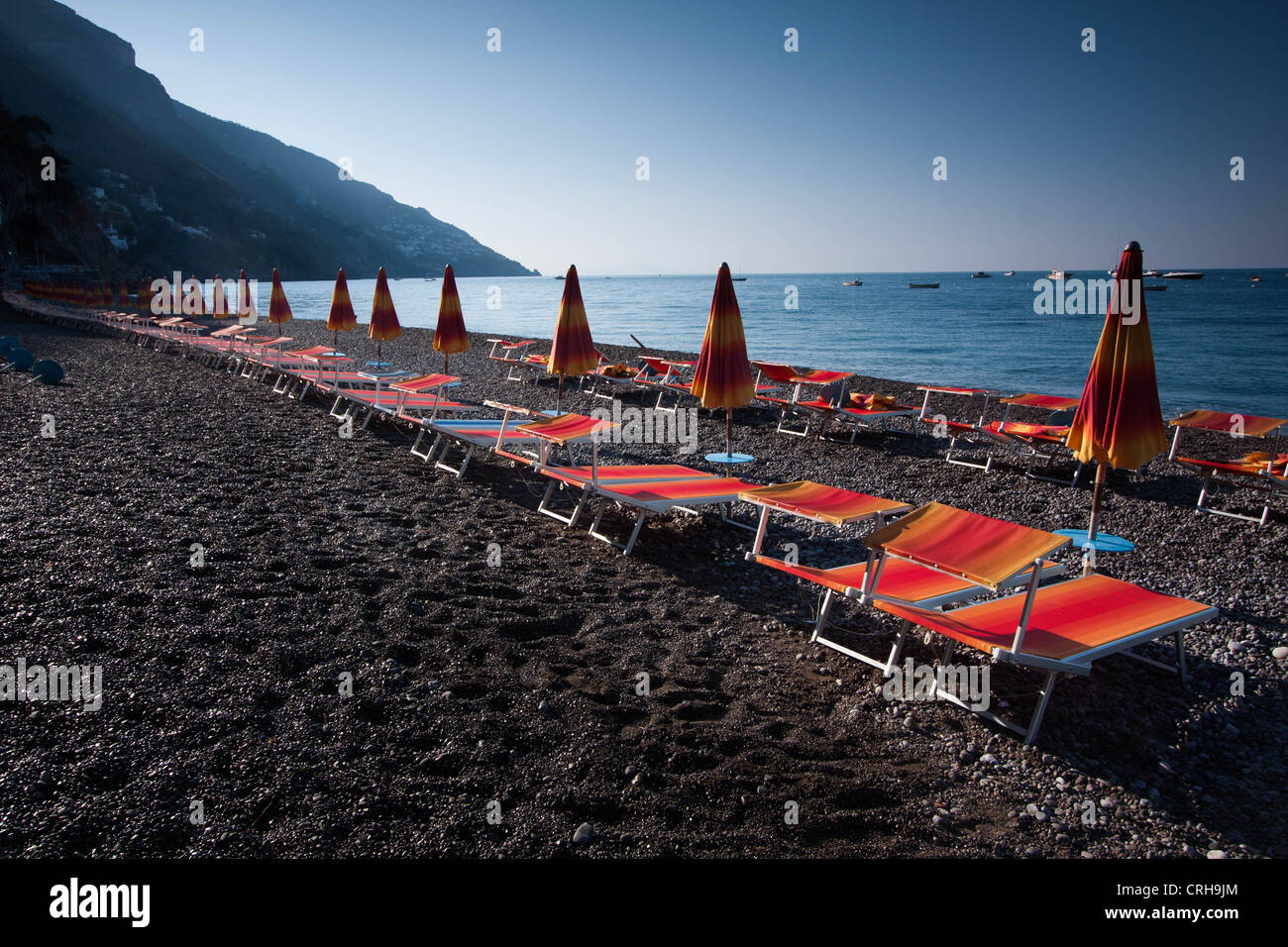 Deck chairs ready on Positano beach, Italy Stock Photo - Alamy