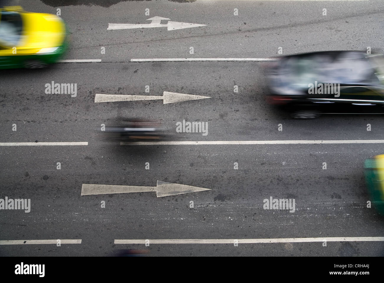 The arrows on the road to a path in the car Stock Photo - Alamy