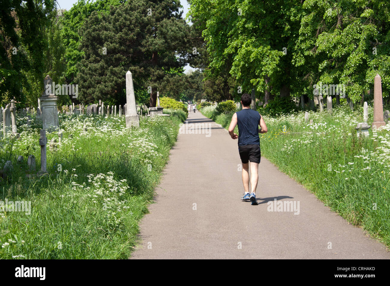 Jogger in Graveyard Stock Photo - Alamy
