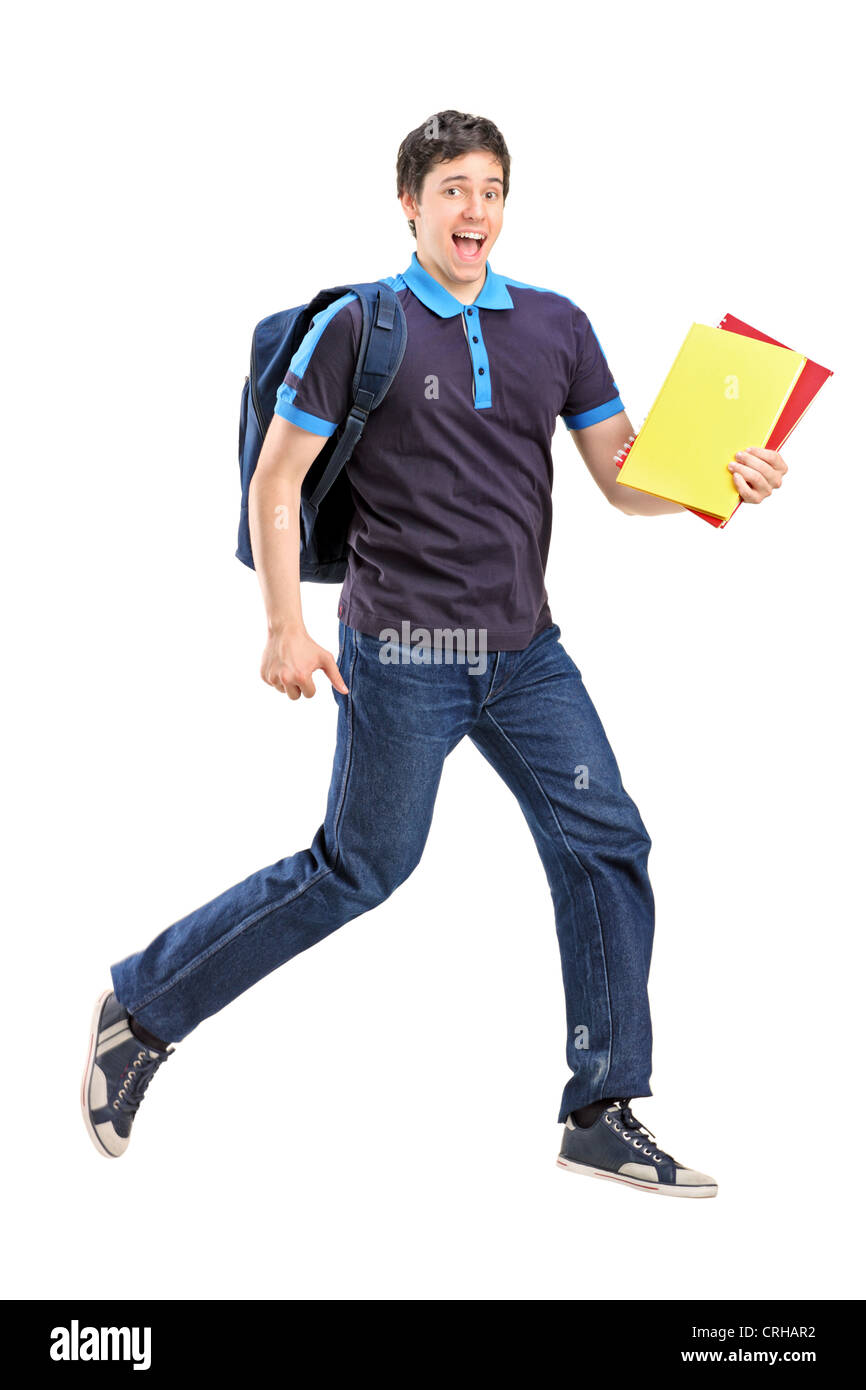 Full length portrait of a male student jumping with notebooks in his ...