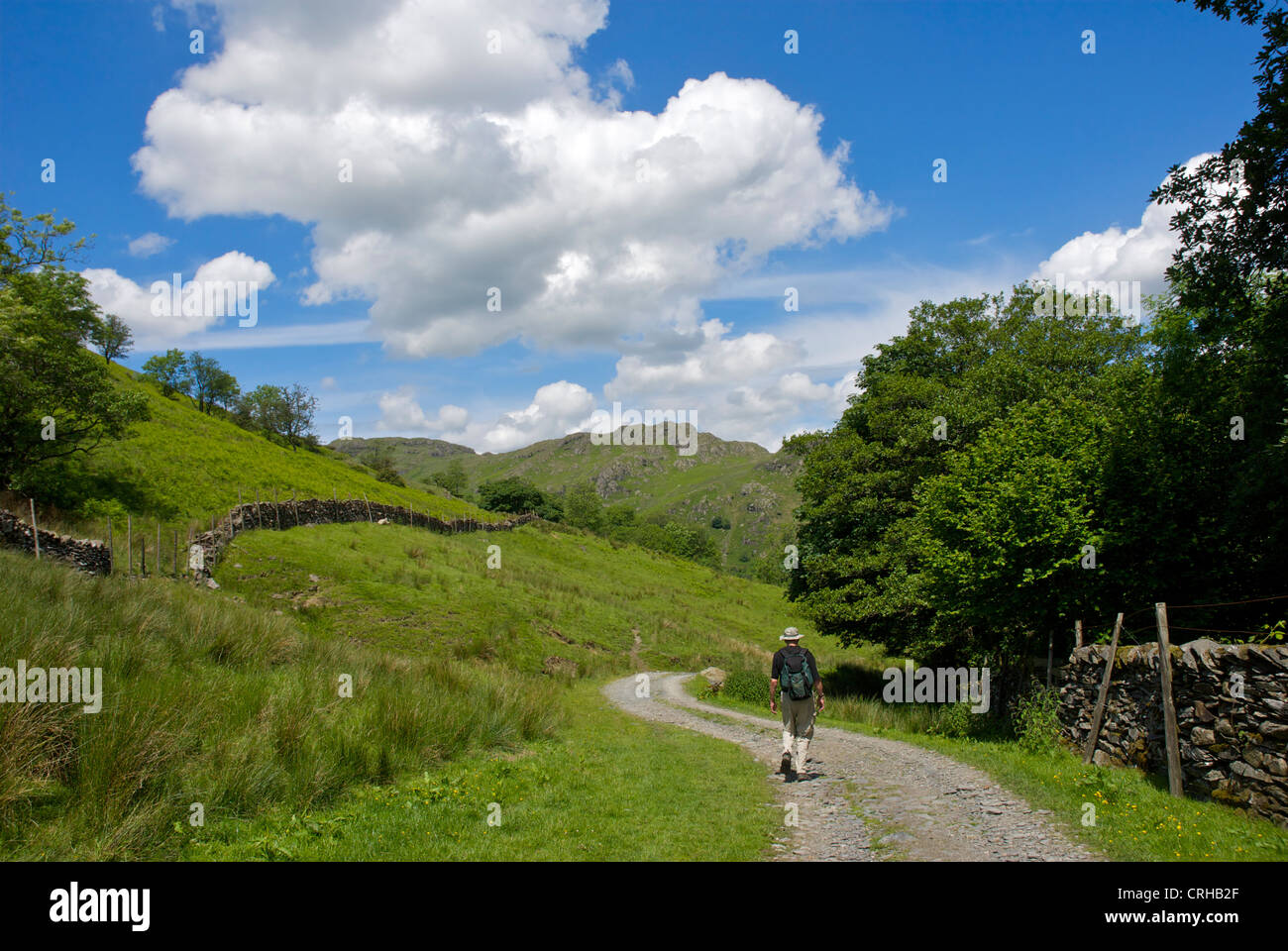 Man walking on track in the Kentmere valley, Lake District National ...