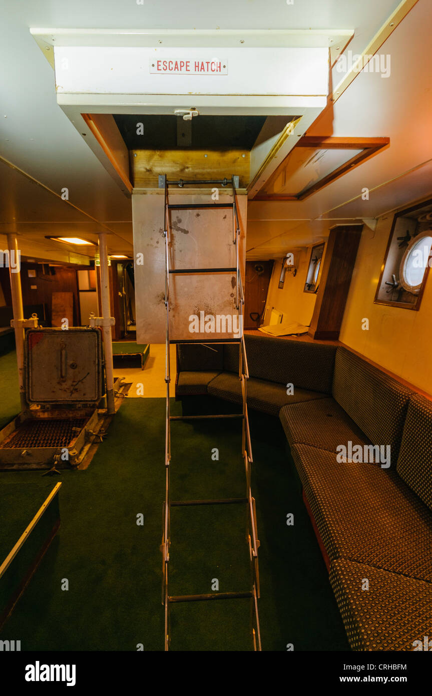 Emergency escape hatch and ladder in the lounge of an old ship Stock ...