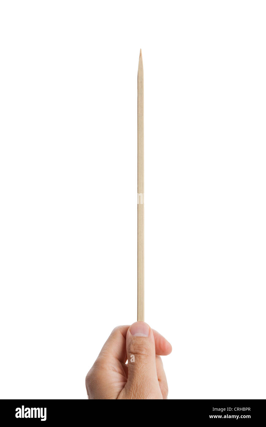 Hand holding Bamboo Skewer with white background Stock Photo - Alamy