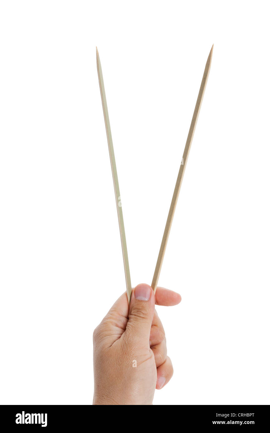 Hand holding Bamboo Skewer with white background Stock Photo - Alamy