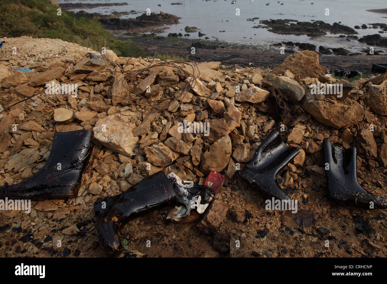 Oil coated boots are left to dry during the oil spill disaster in ...