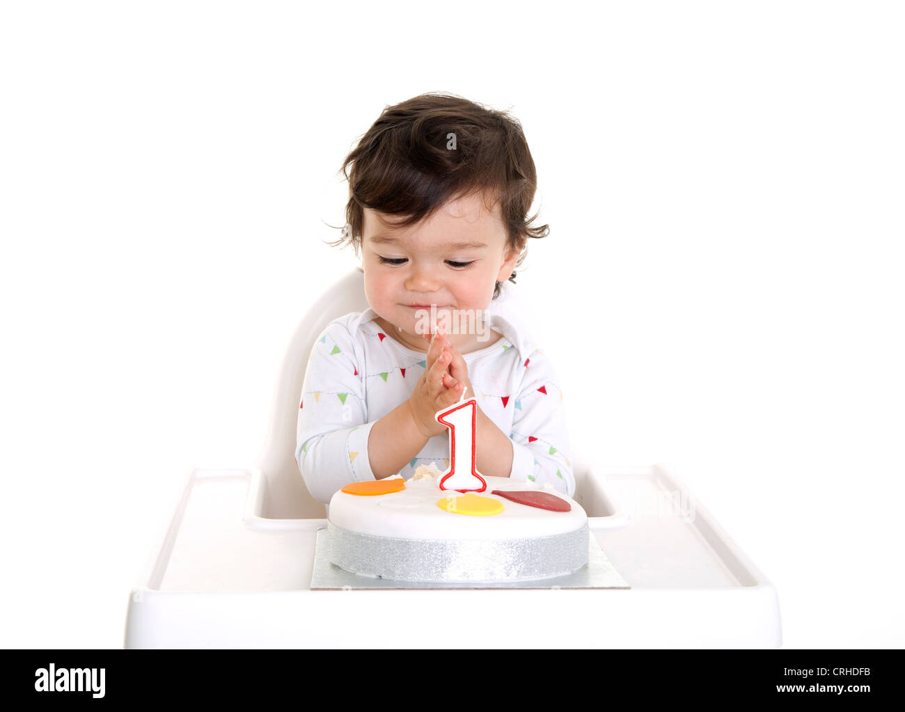 Baby looking at his first birthday cake Stock Photo - Alamy