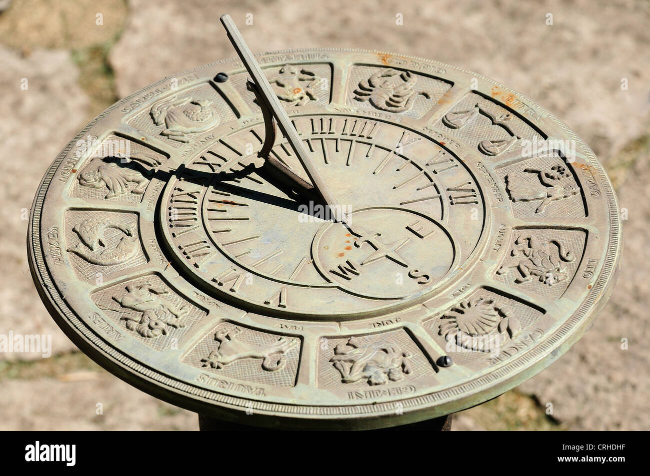 Sundial with astrological signs and Roman numerals Stock Photo - Alamy
