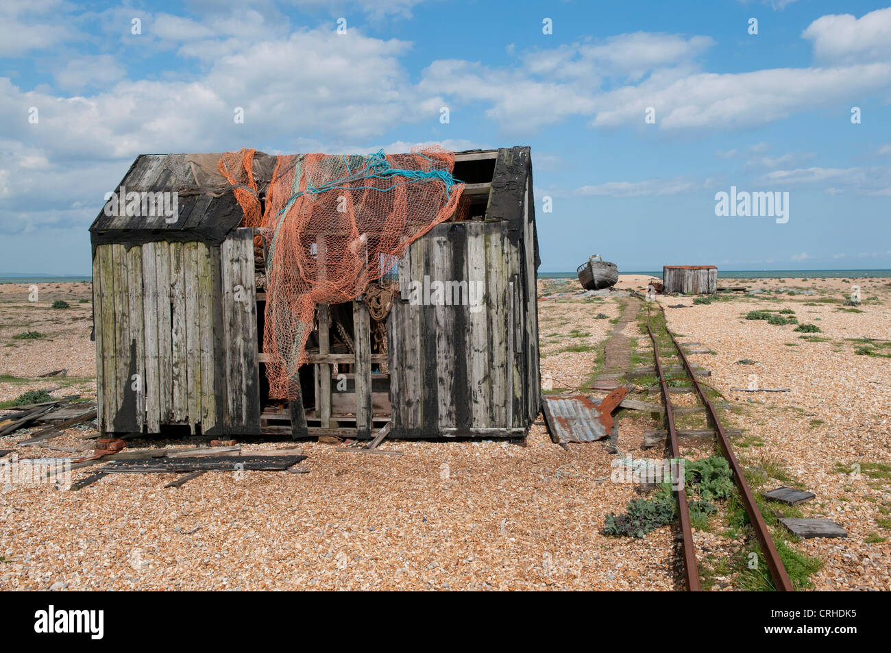 Derelict hut and rusty old gauge track on Dungerness beach in Kent ...