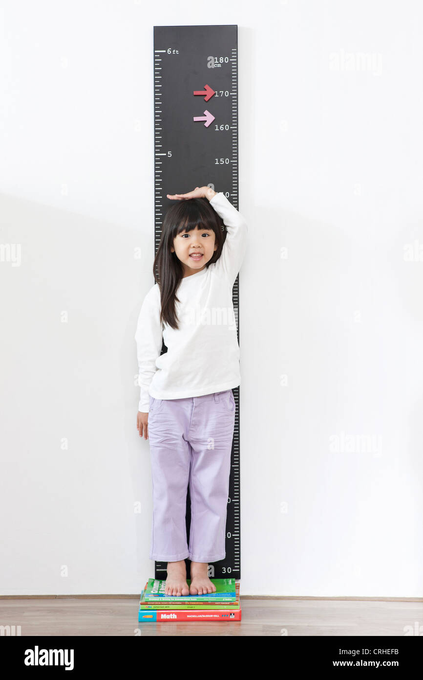 Measuring height in woman hi-res stock photography and images - Alamy