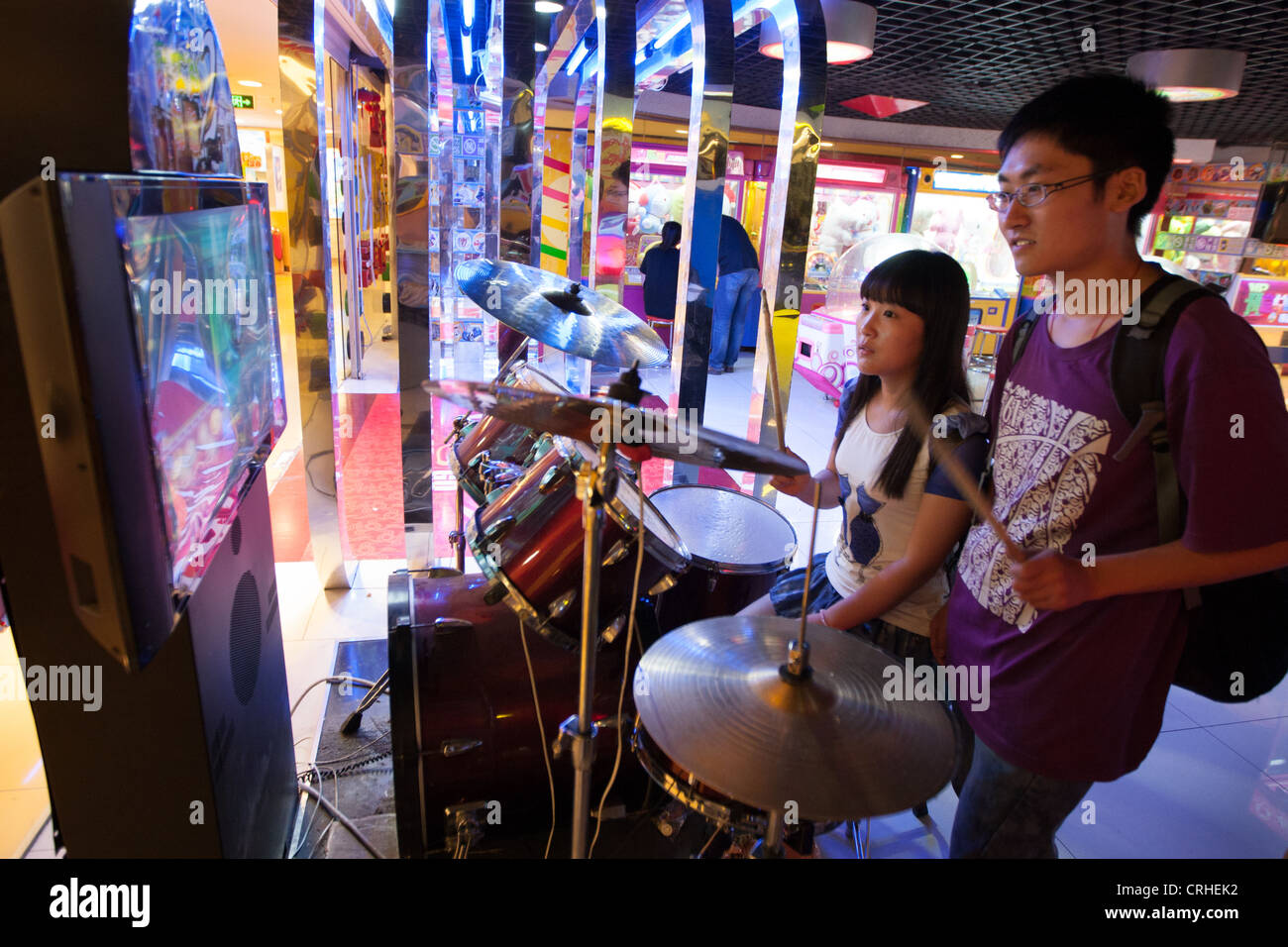 Amusement gaming entertainment arcade with shoppers, in Beijing, China ...