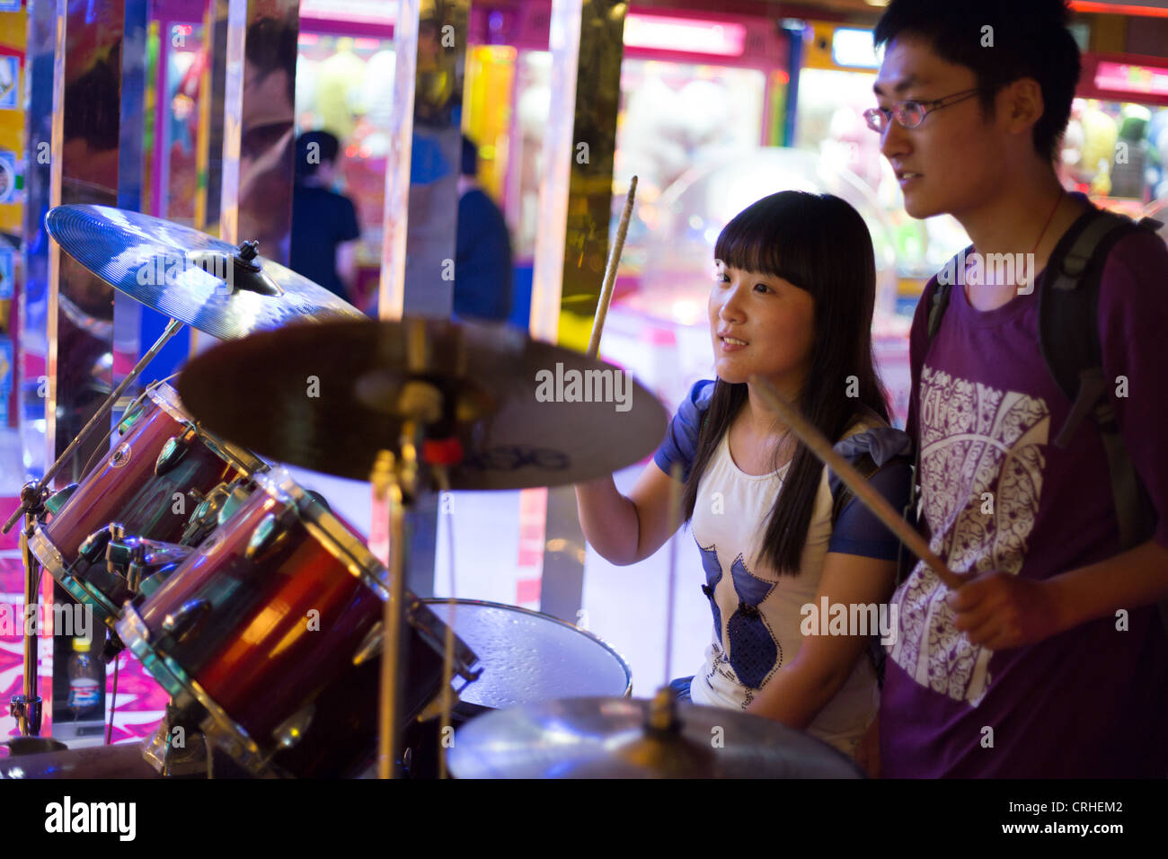 Amusement gaming entertainment arcade with shoppers, in Beijing, China ...