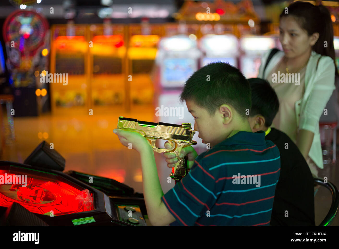 Amusement gaming entertainment arcade with shoppers, in Beijing, China ...
