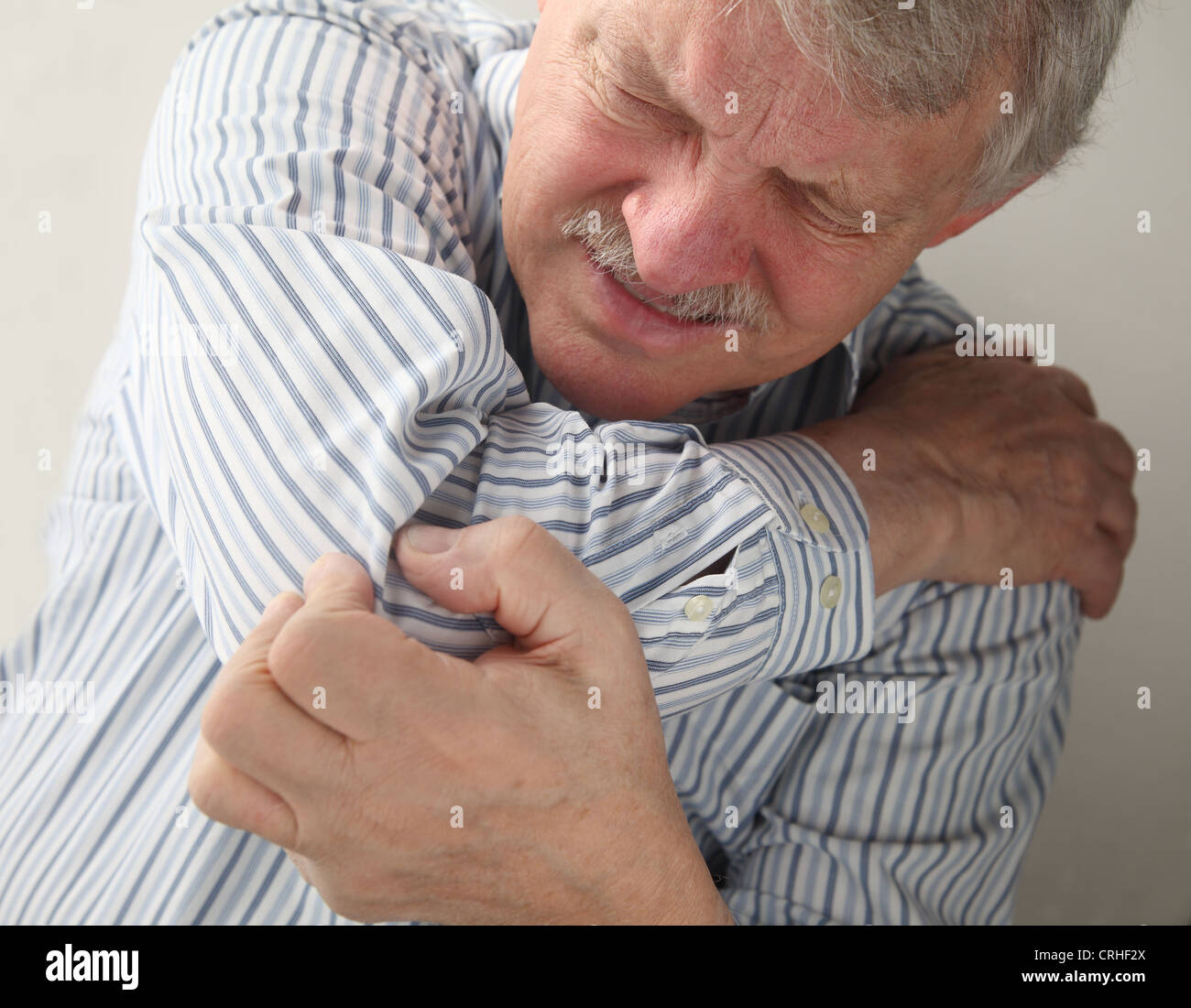 Senior man suffering from shoulder hi-res stock photography and images ...