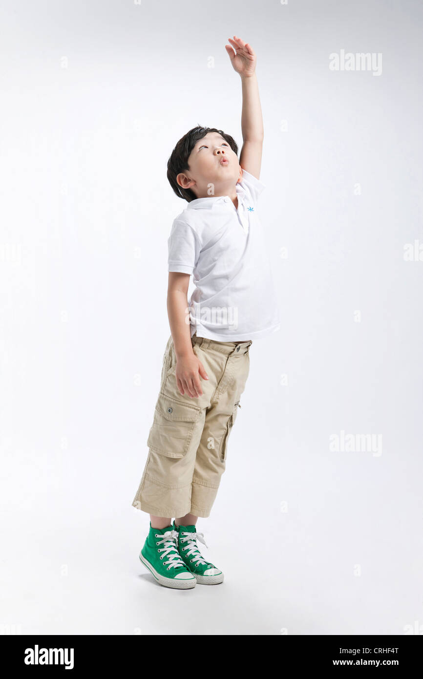 Side Profile Boy Hand Raised Stock Photos & Side Profile Boy Hand ...