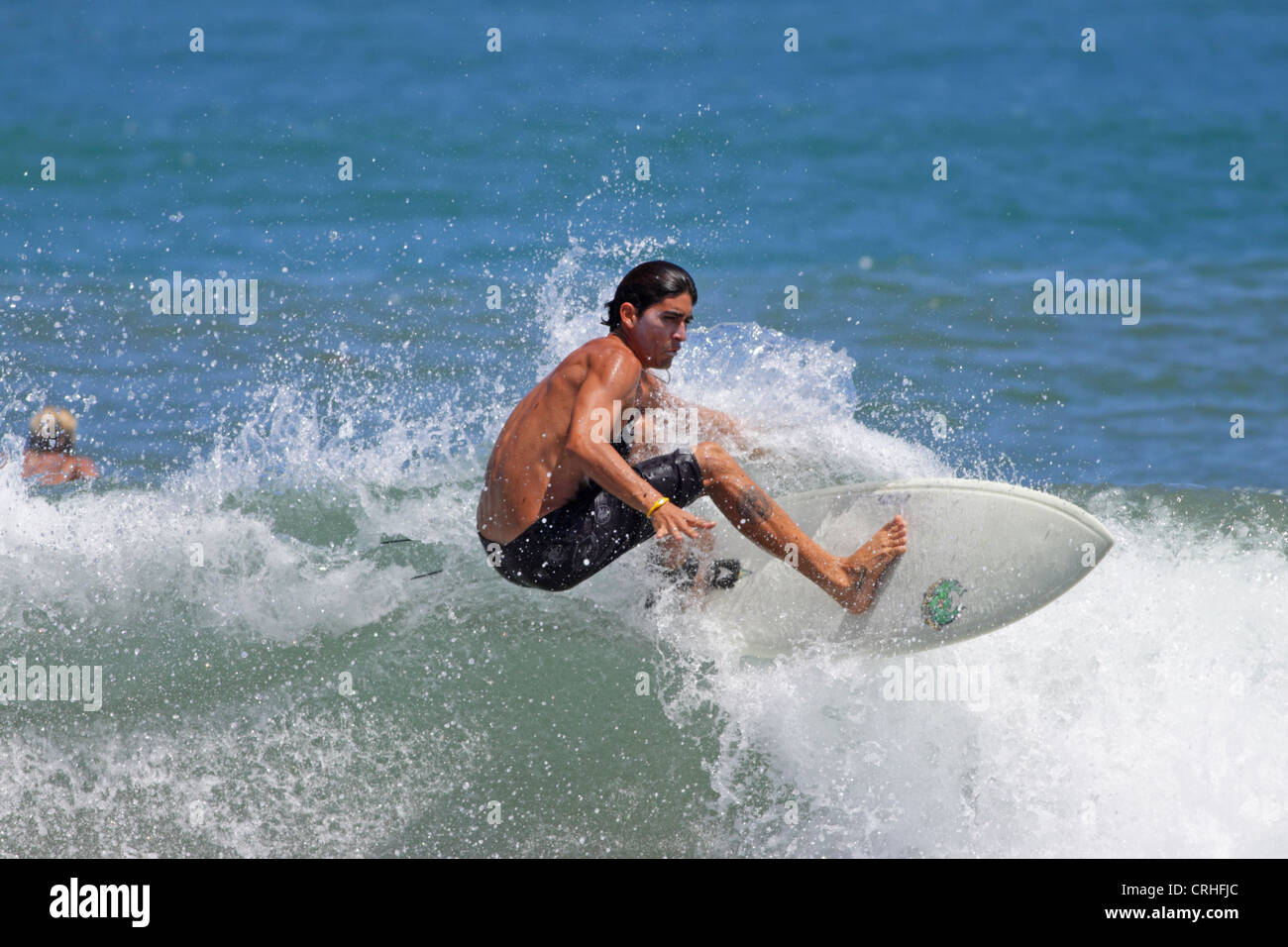 Surfer at Playa Cocles, Puerto Viejo, south Caribbean coast, Costa Rica ...