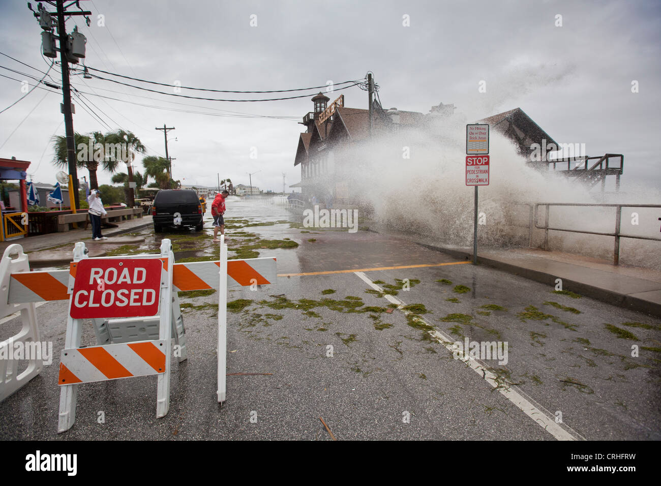 A huge wave crashes over the seawall of Dock Street in downtown Cedar ...
